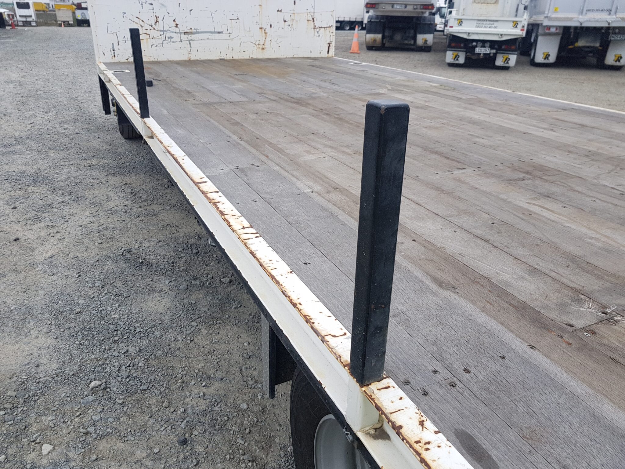 What is a flat deck truck or trailer?