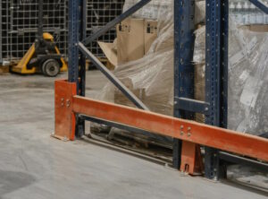 What is most likely to cause racking failure around forklifts?